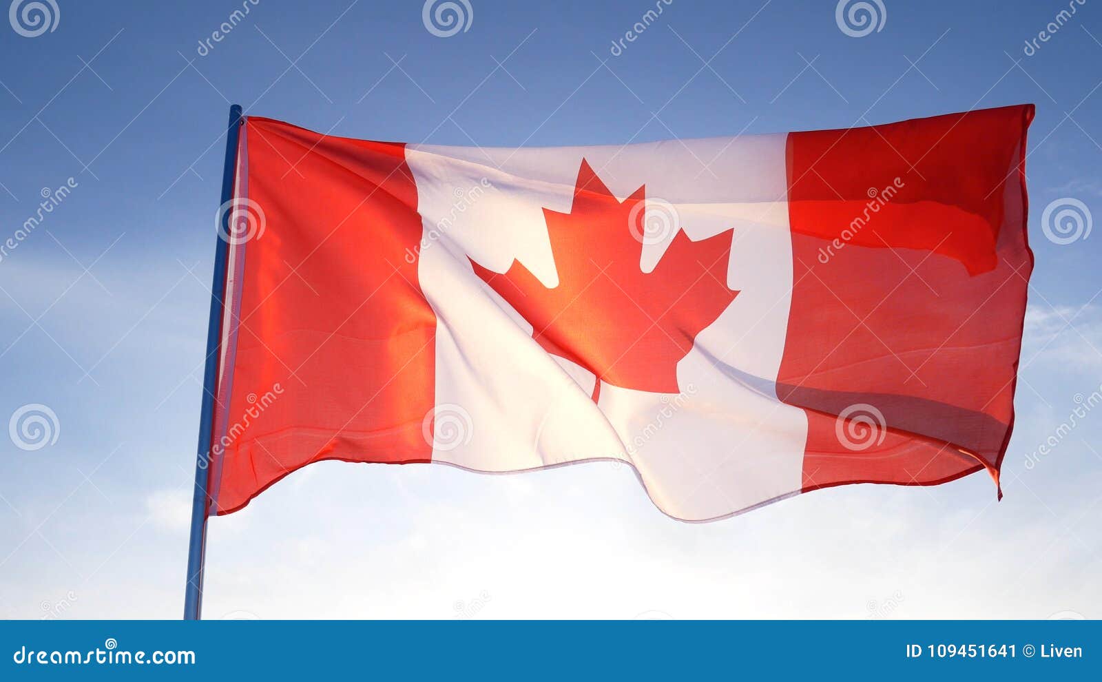 Canada Flag on Clear Blue Sky Stock Image - Image of nation, folded ...