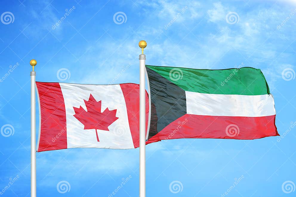 Canada and Kuwait Two Flags on Flagpoles and Blue Cloudy Sky Stock ...