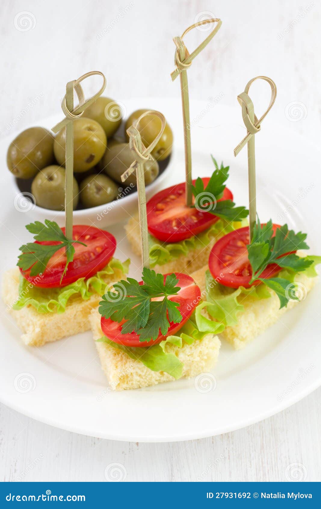 Canape with Tomato, Lettuce and Parsley Stock Photo - Image of olives ...