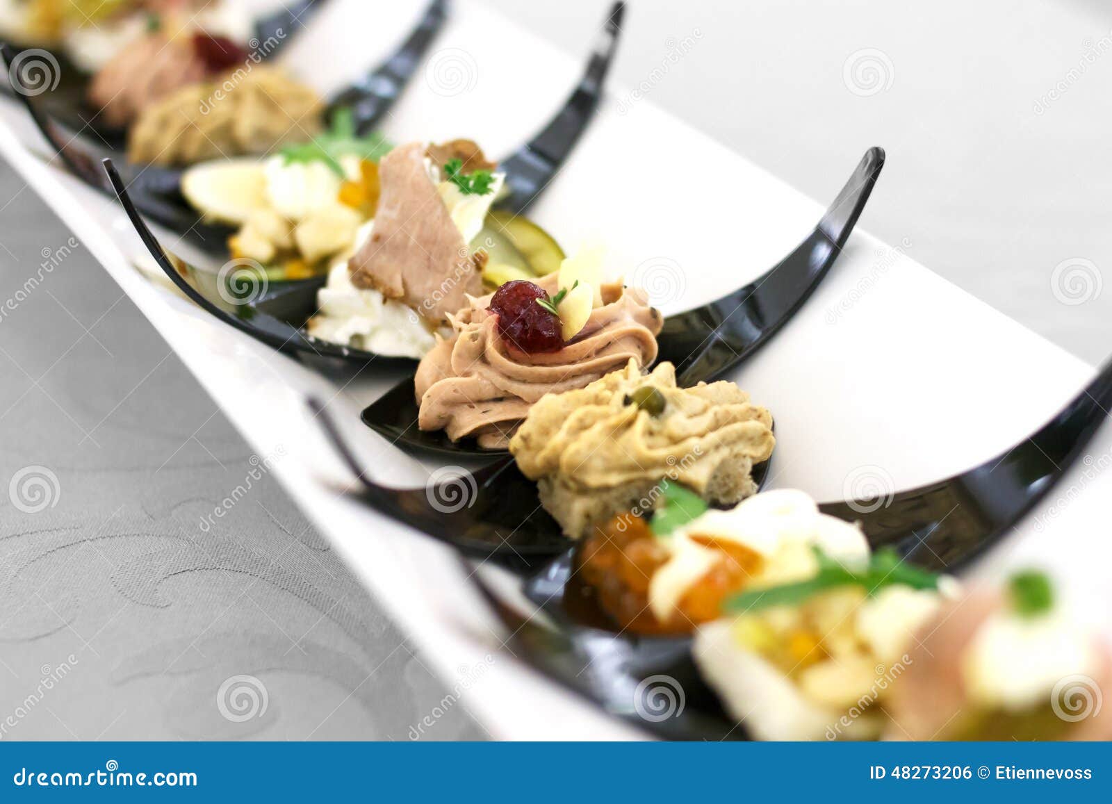 Canapes on Black Plastic Spoons Stock Photo - Image of party ...