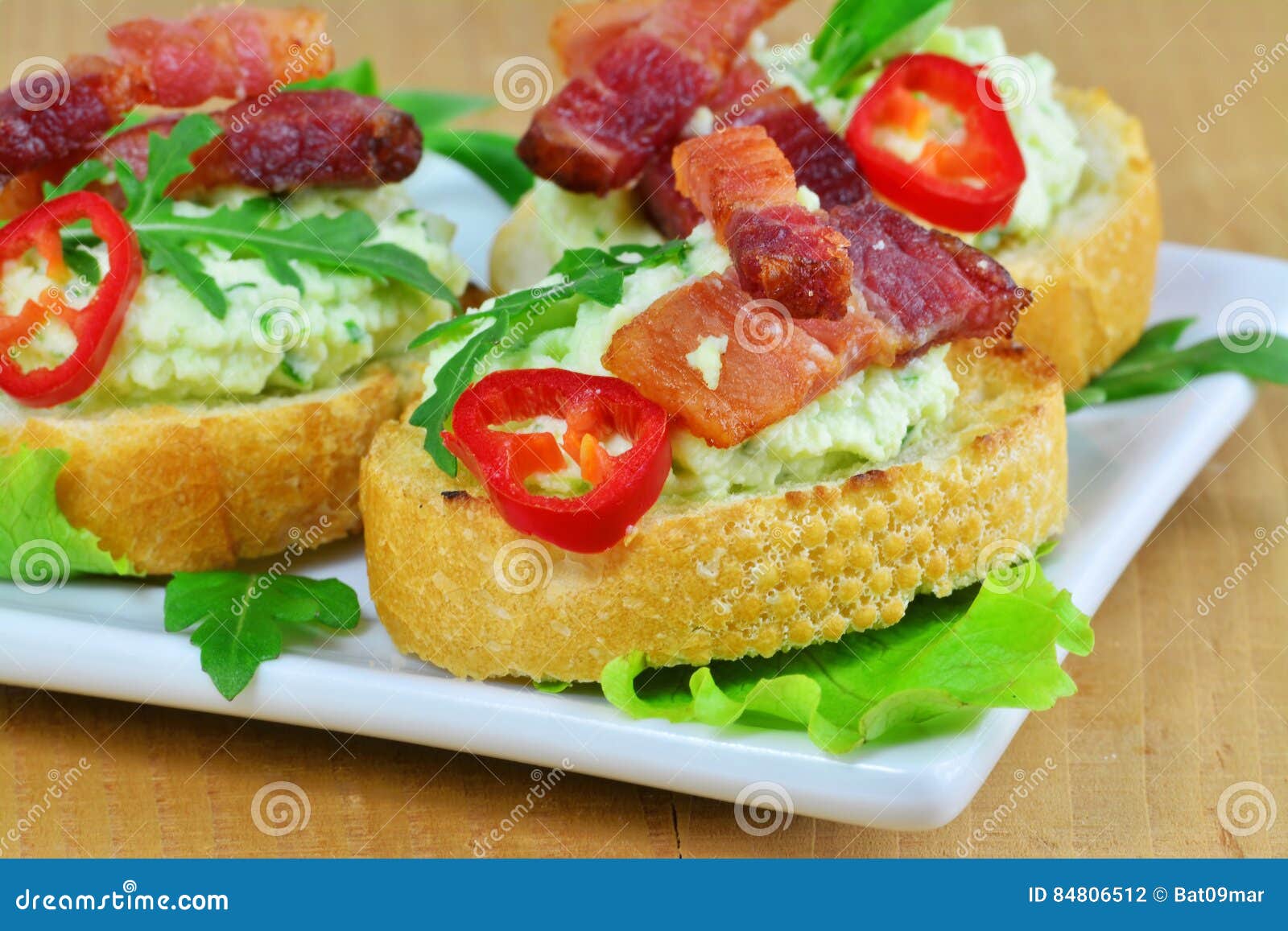 Canapes with Herbed Cream Cheese, Bacon, Chilly and Arugula Stock Photo ...