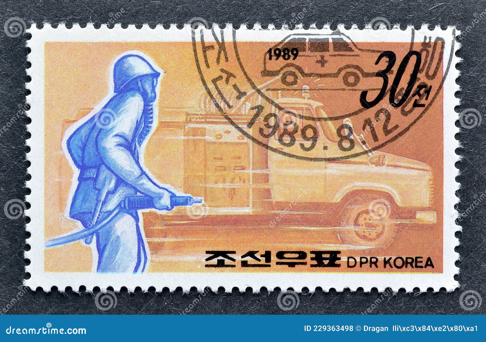 Cancelled Postage Stamp Printed by North Korea, that Shows Fireman and ...