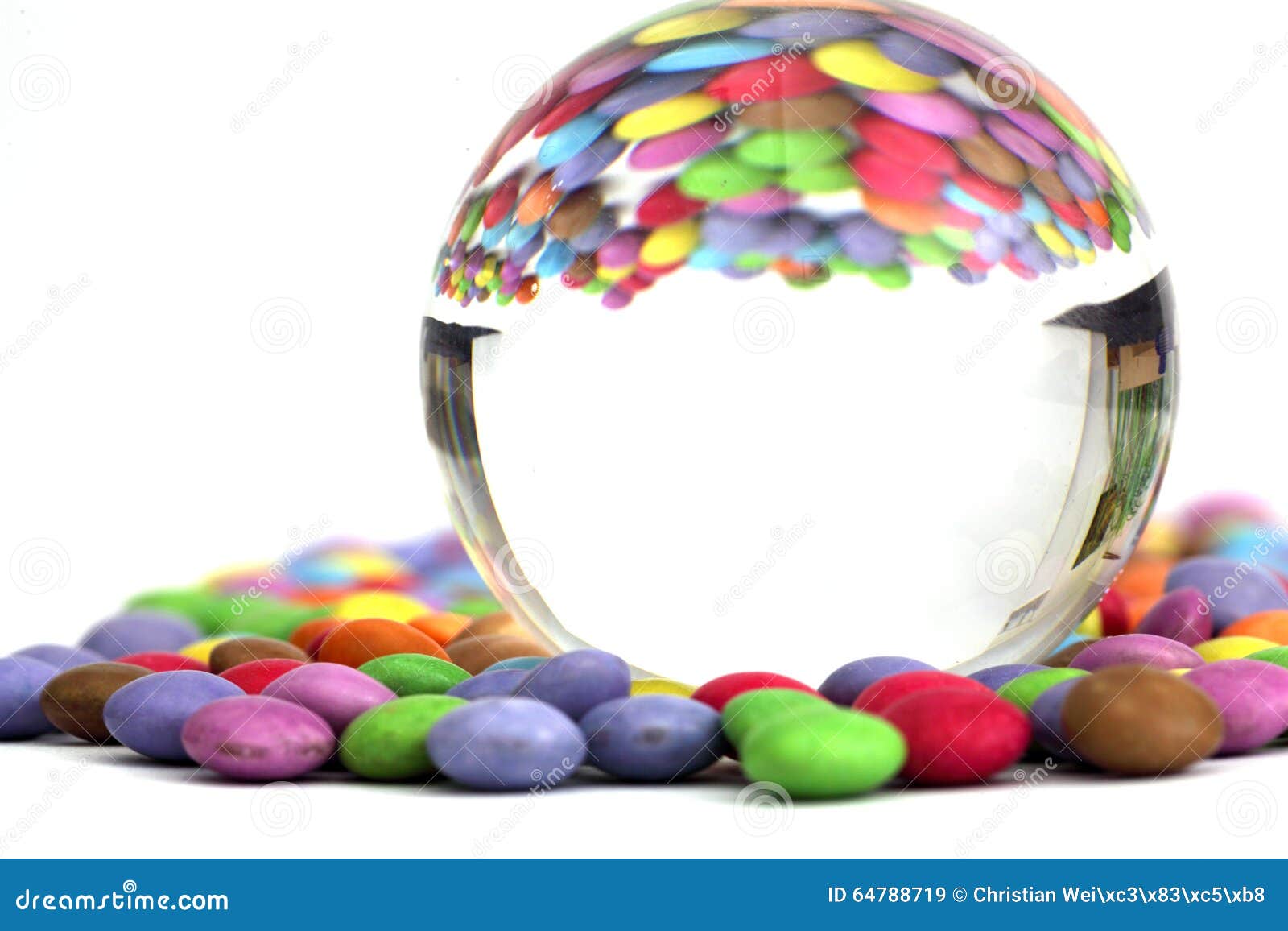 Candies with a glass ball stock image. Image of delicious - 64788719