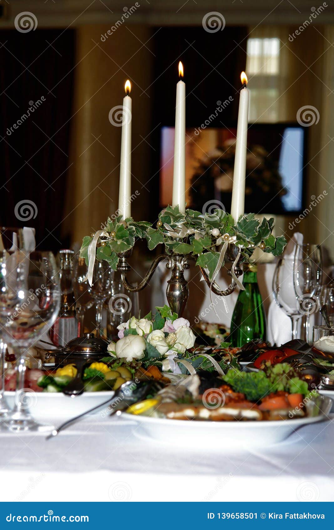 Candle Light With Burning Candles And Flowers On The Table Before A ...