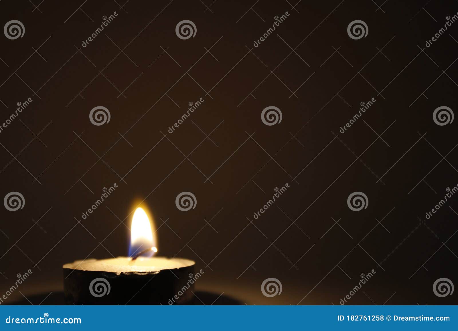Candle lit in dim light stock photo. Image of black - 182761258