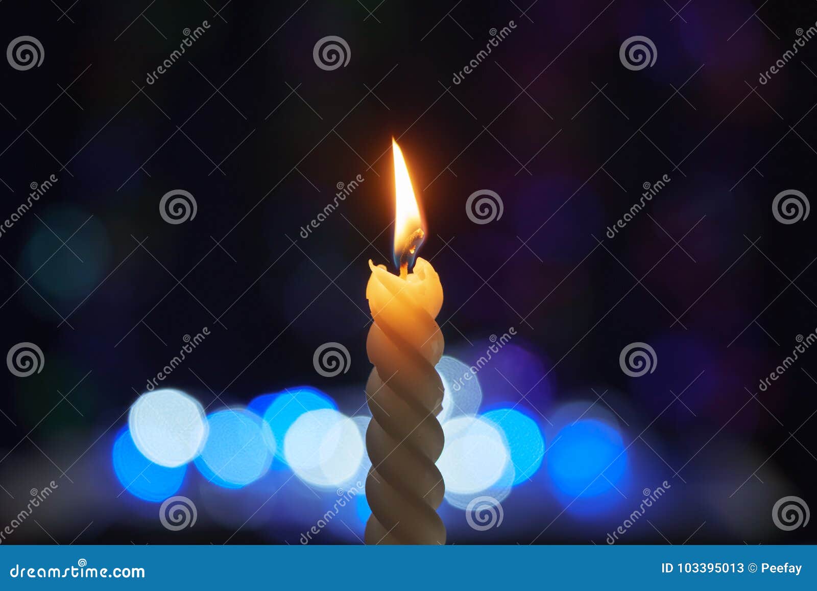 Candle Lit in Front of Festive Lights Christmas Stock Image - Image of ...