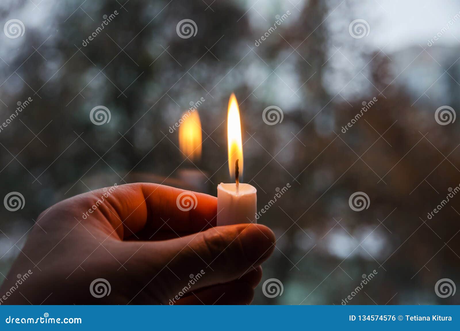 A Candle Lit in the Hand of a Woman Stock Photo - Image of candlestick ...