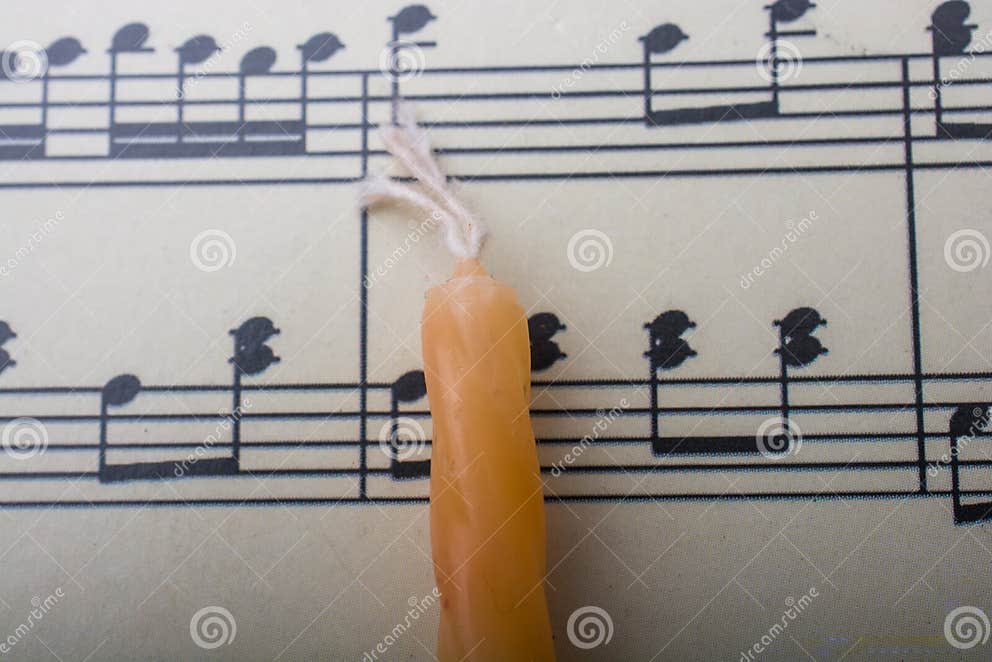 Candle Placed on Paper with Musical Notes Stock Photo - Image of notes ...