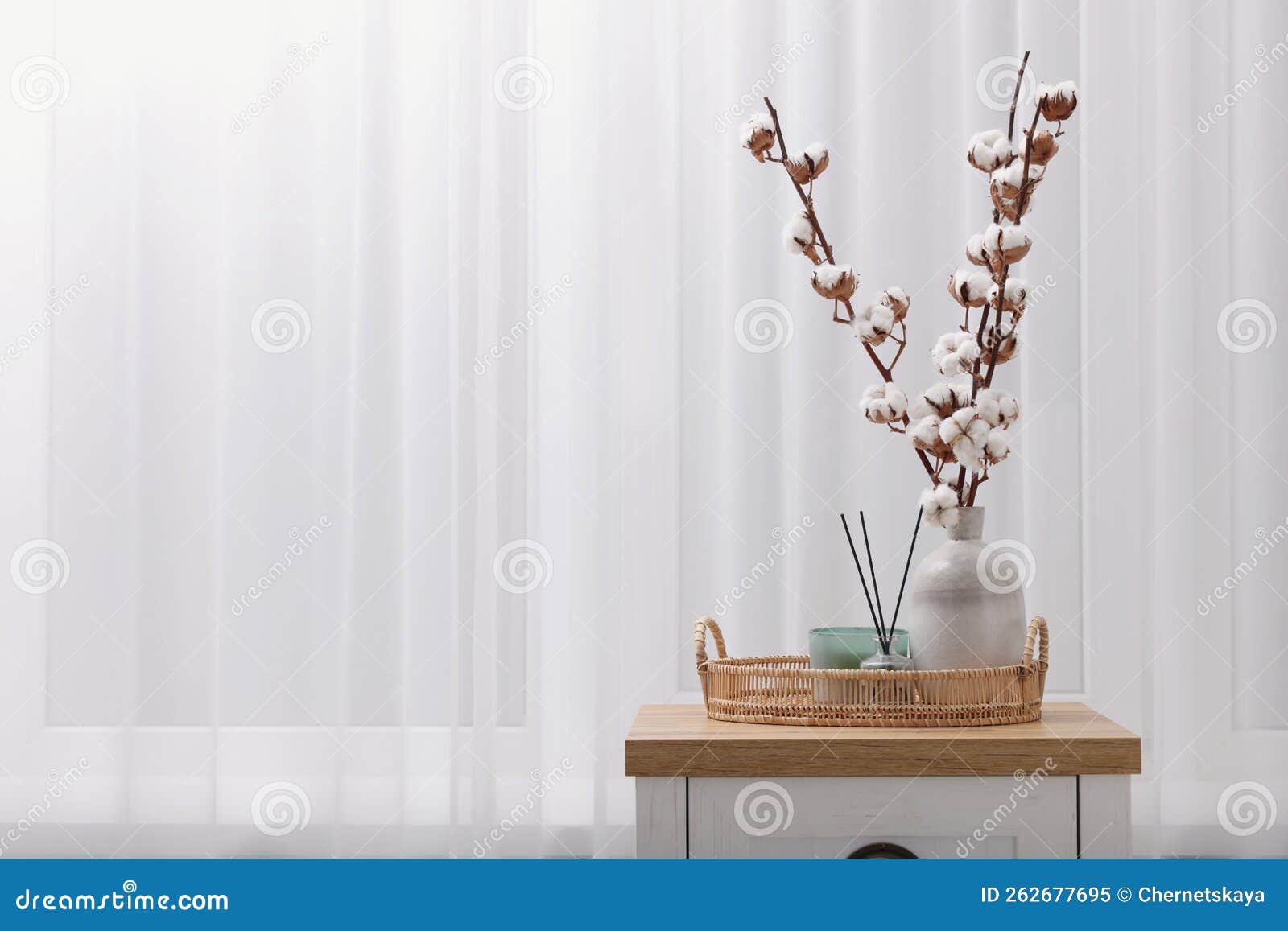 Candle, Reed Diffuser and Vase with Cotton Branches on Wooden Commode ...