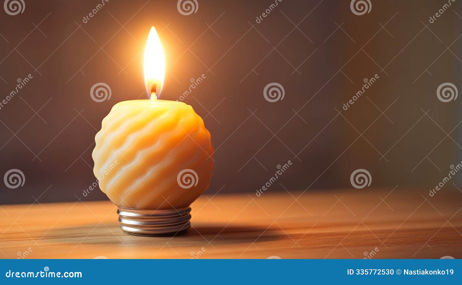 Candle Shaped Like a Light Bulb on a Wooden Surface, Creative Lighting ...