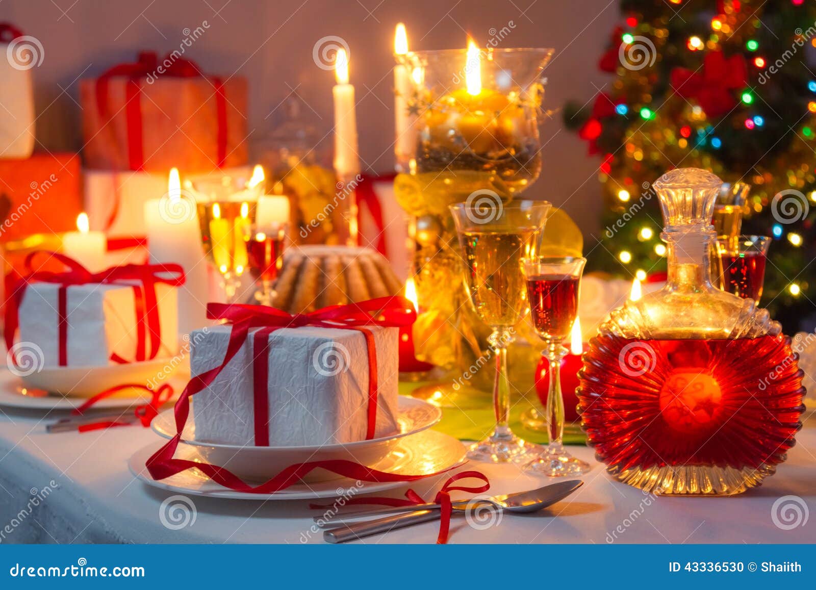 Candlelight and Gifts All Around the Christmas Table Stock Photo ...