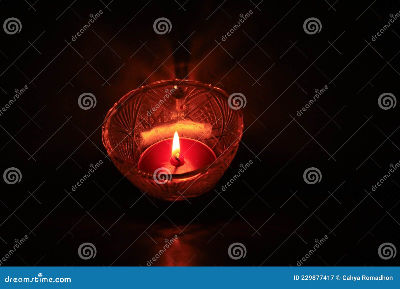 The Candlelight Inside the Glass Illuminates the Darkness at Night ...