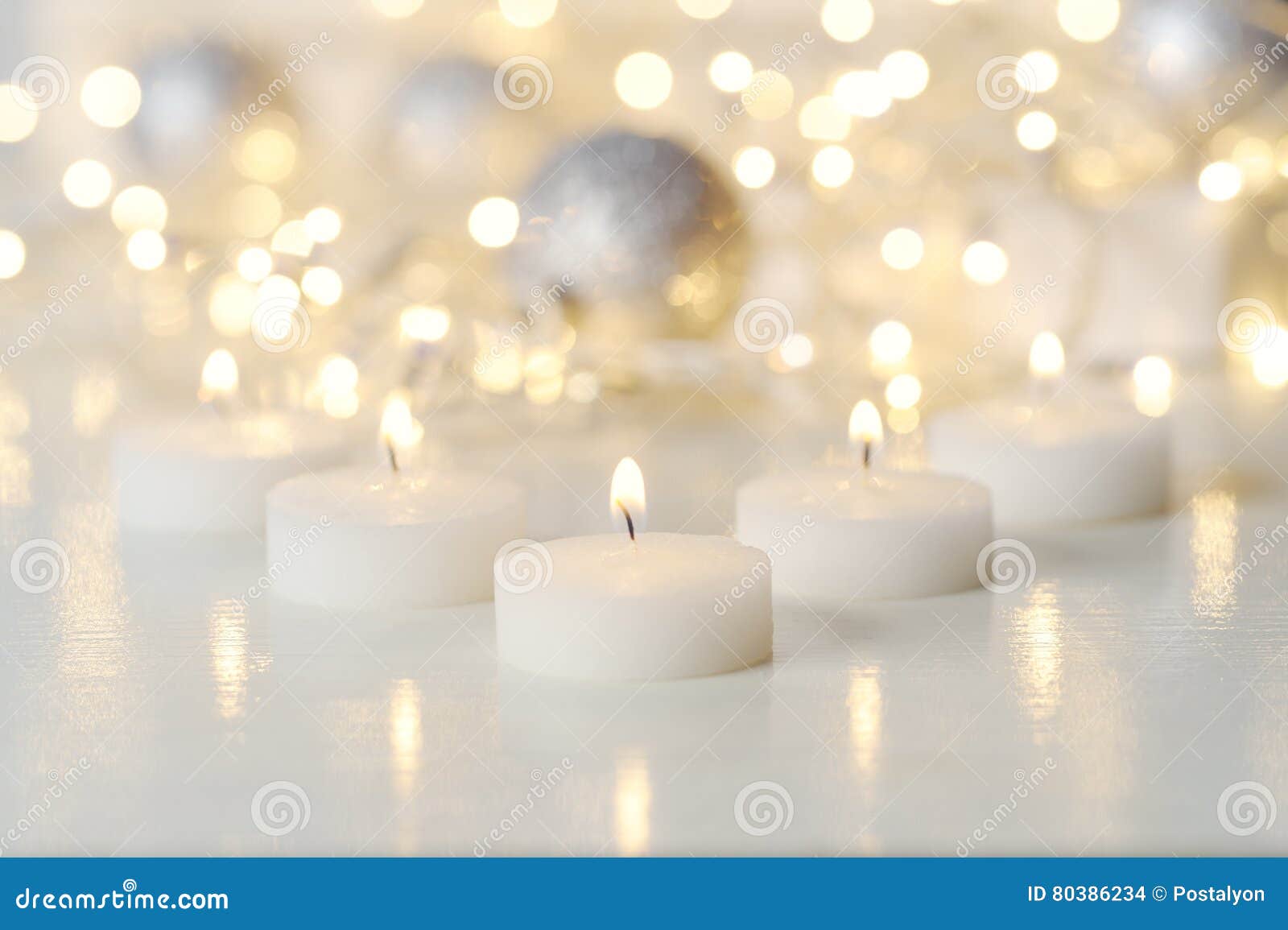 Candles and Christmas Decoration with Defocused Lights. Stock Photo ...