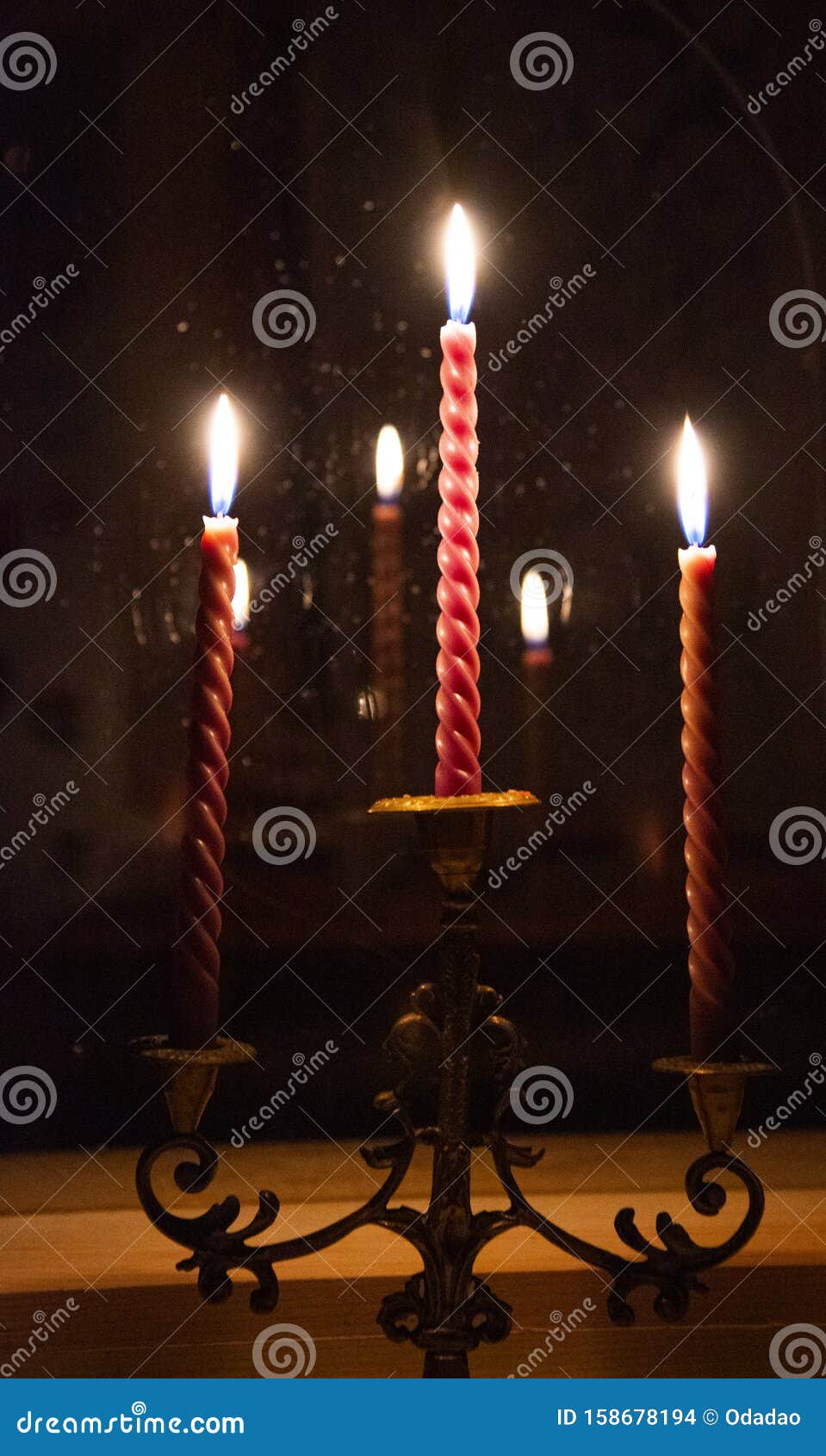 A Candlestick with Three Red Burning Candles is Worth on the Windowsill ...