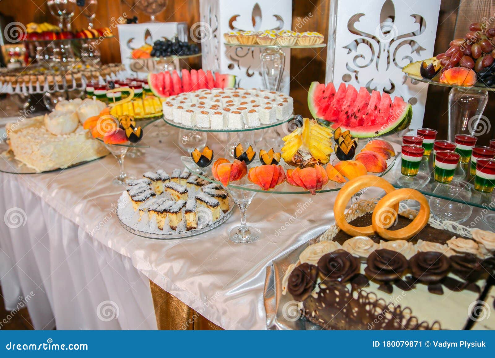 Candy Bar at the Wedding Reception. Cakes, Sweets and Fruit on the ...