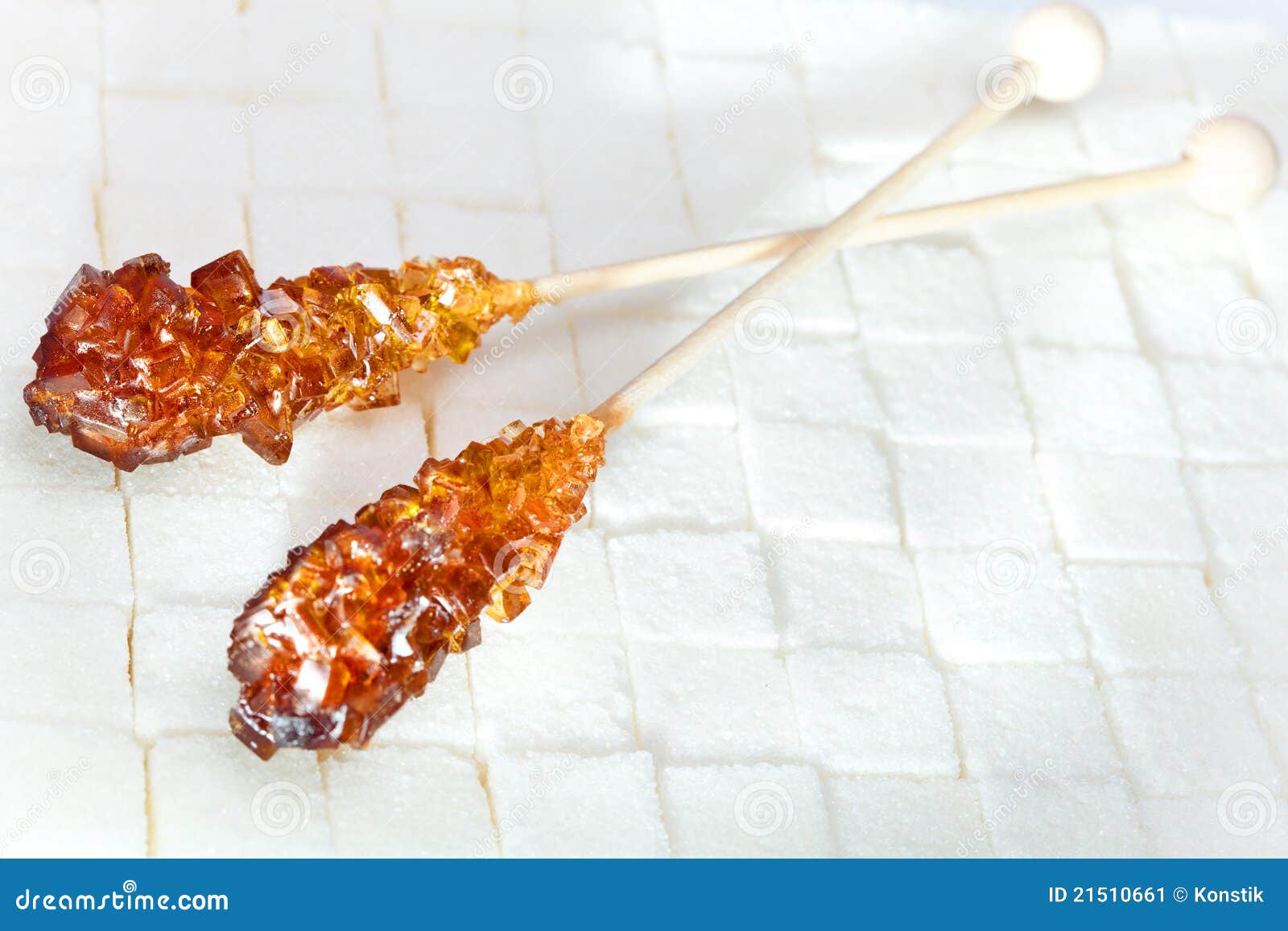 Candy Brown Sugar on a Stick Lies on White Sugar Stock Image - Image of ...