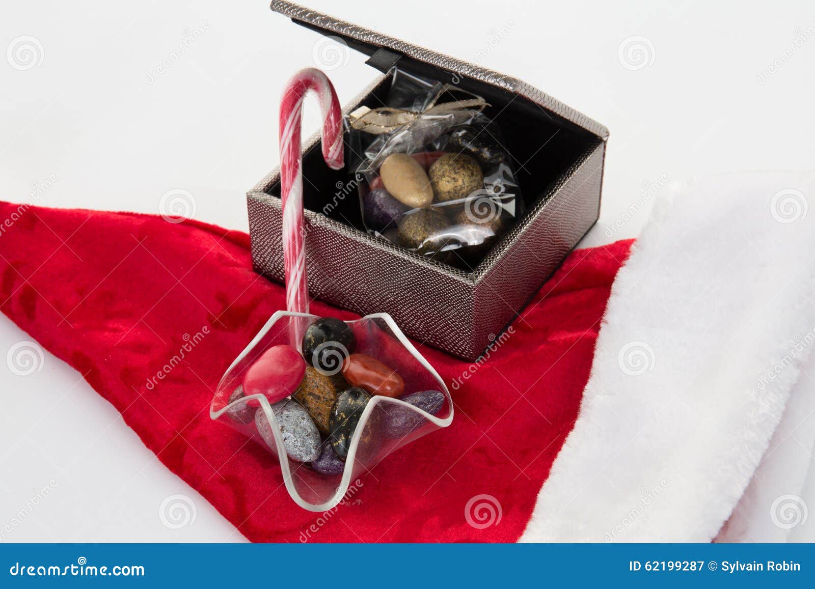 Candy Canes, Candies and Chocolate on Santa Hat Isolated Stock Image ...