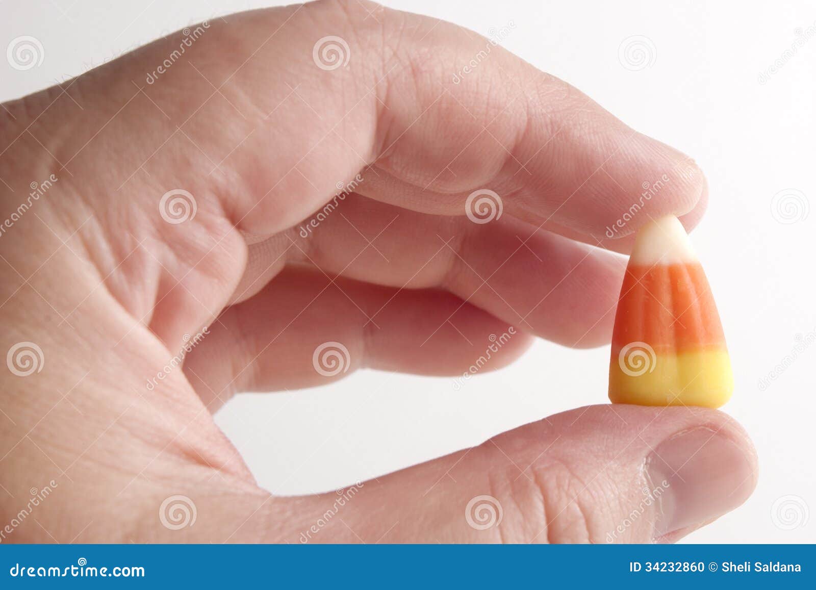 Candy corn stock photo. Image of sugary, holding, fingers - 34232860