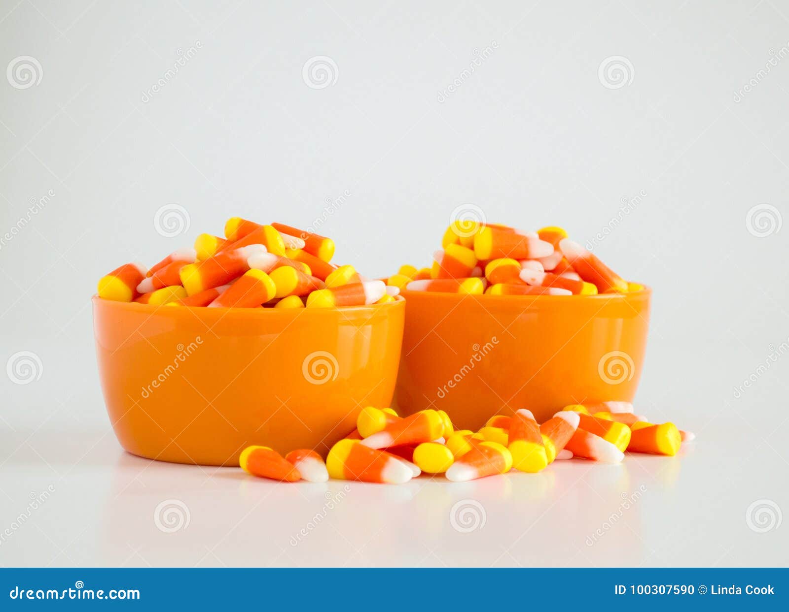 Candy Corn in Two Orange Bowls with Overflow on White Stock Photo ...