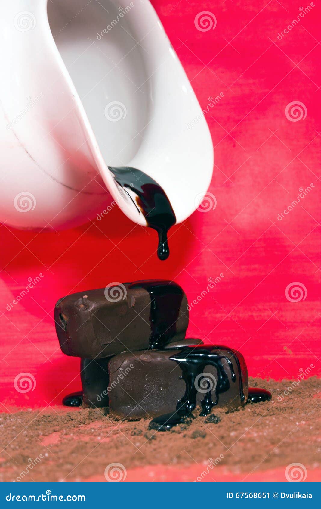 Candy Poured Chocolate from a White Pitcher on a Red Background 2 Stock ...