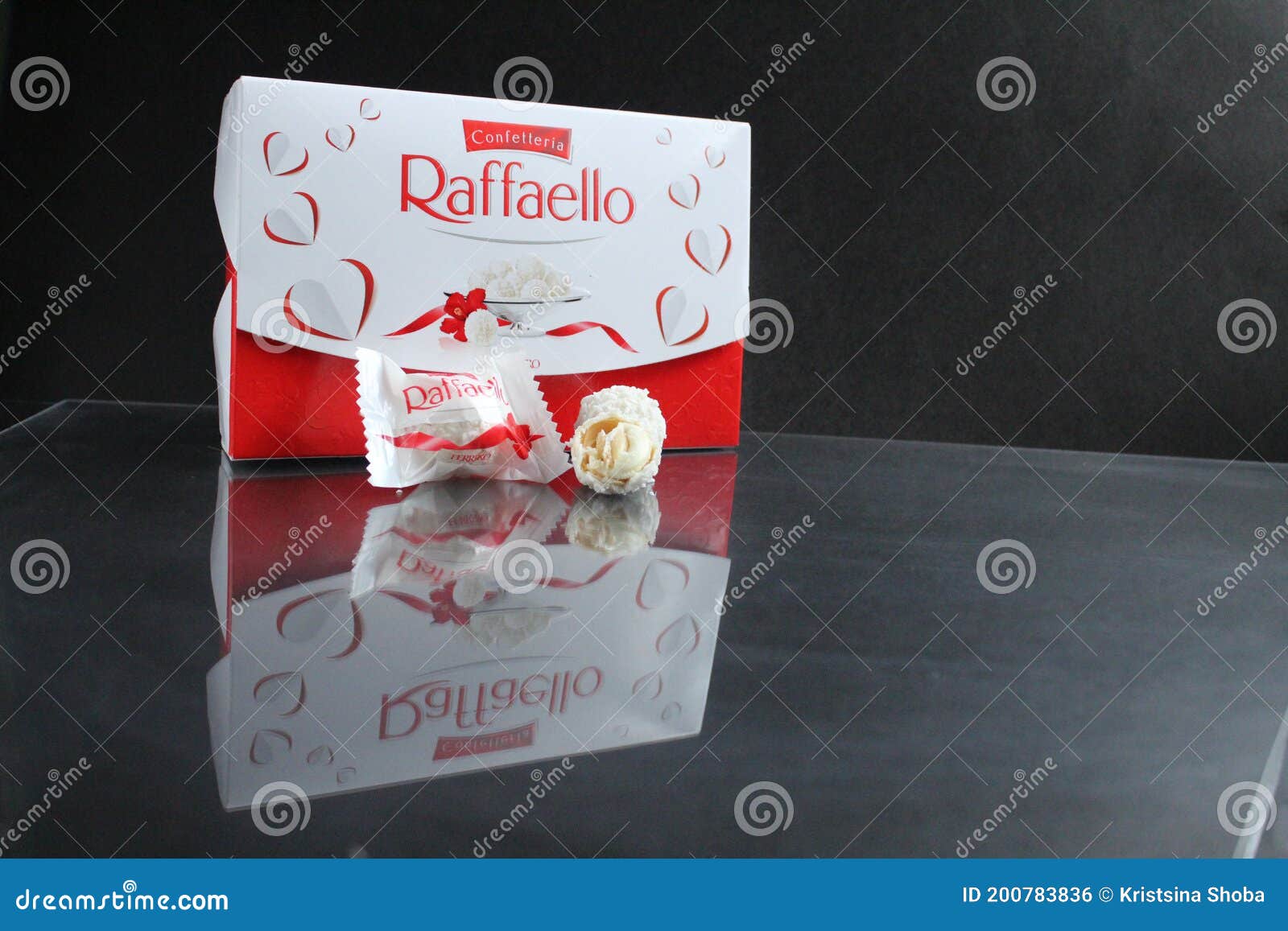 Candy And A Square Rectangular Gift Box By Raffaello Stands On A Black ...