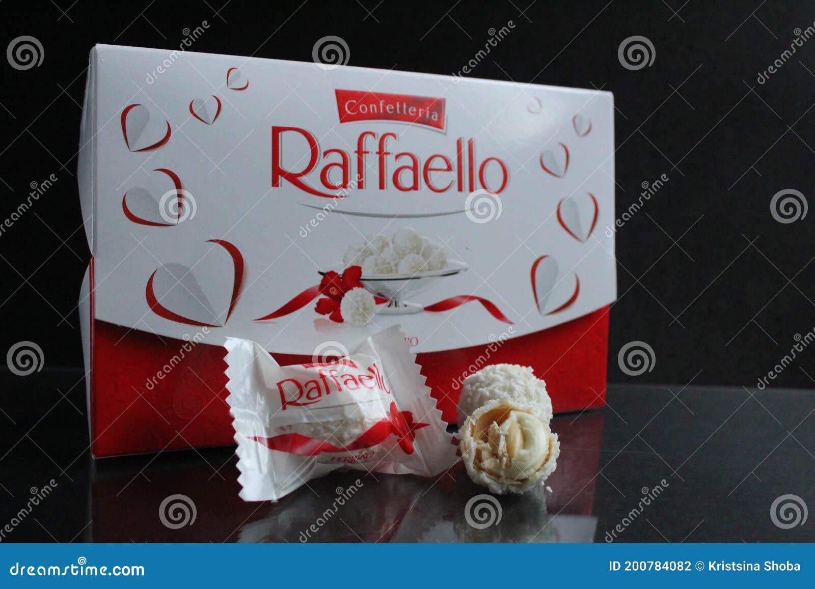Candy and a Square Rectangular Gift Box by Raffaello Stands on a Black ...