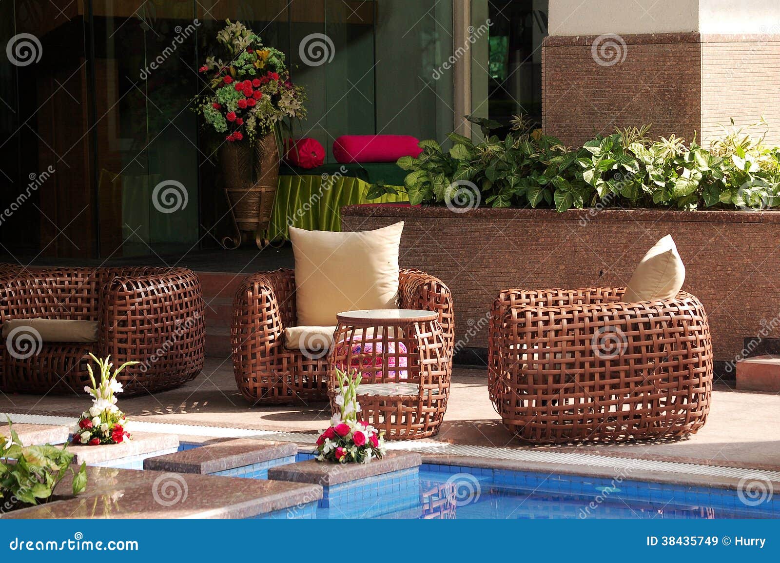 Cane chairs beside pool stock image. Image of chairs - 38435749
