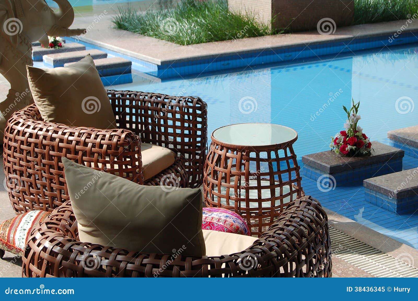 Cane chairs beside pool stock image. Image of furniture - 38436345