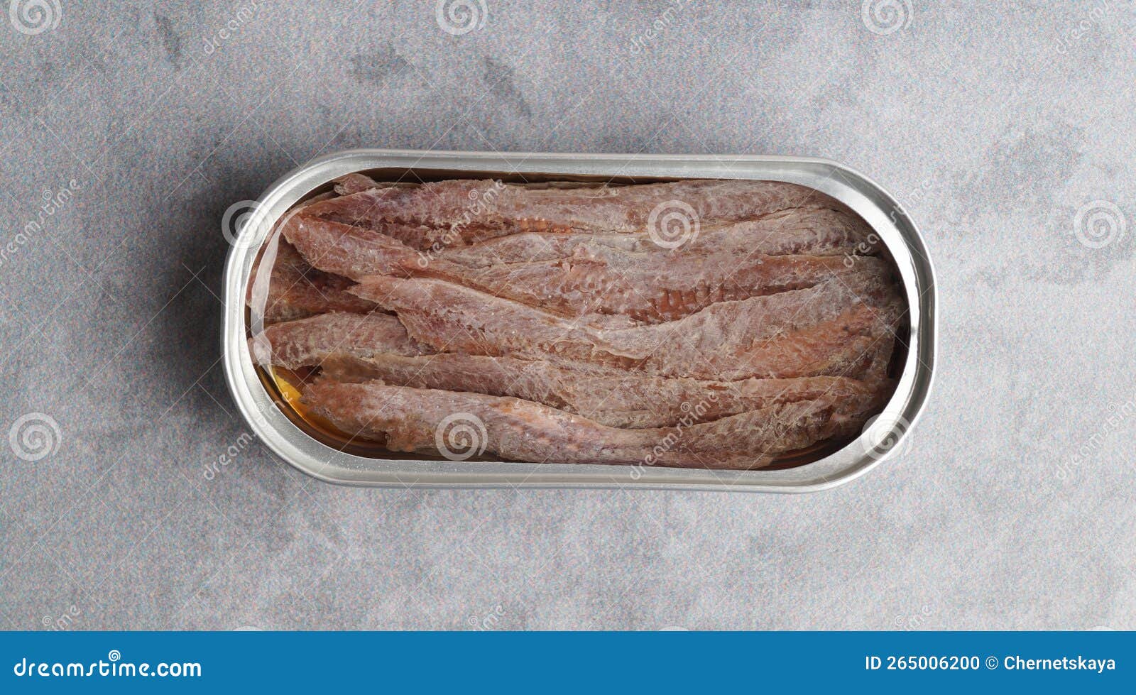 Canned Anchovy Fillets on Light Gray Table, Top View Stock Photo ...