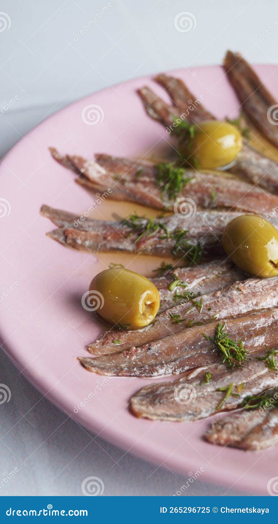 Canned Anchovy Fillets with Olives on White Table Stock Image - Image ...