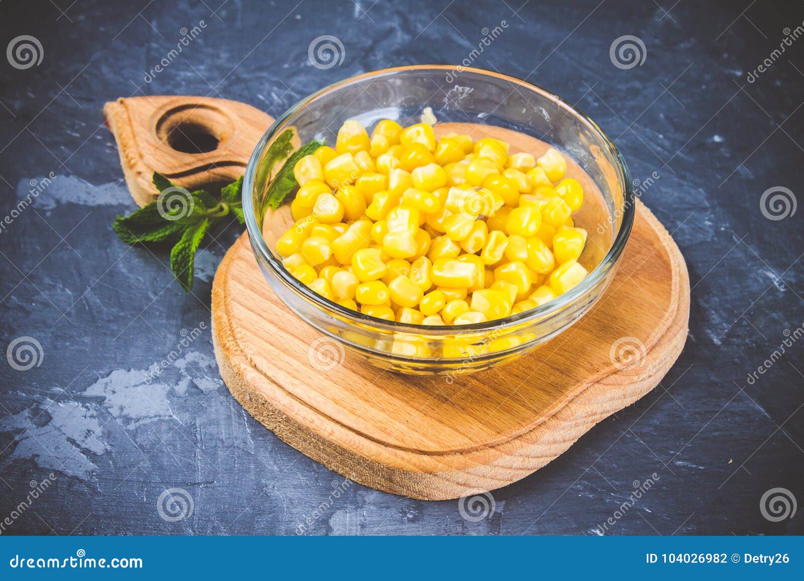 Canned Corn in a Glass Plate on a Gray Concrete Background. Stock Photo ...