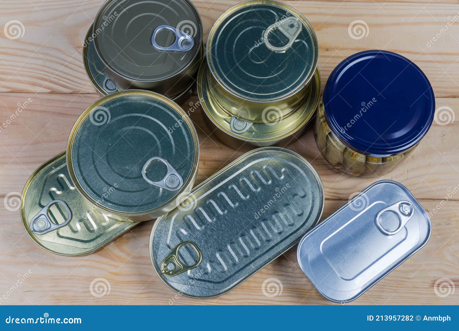 Canned Fish in Tin Cans and Glass Jar, Top View Stock Photo - Image of ...