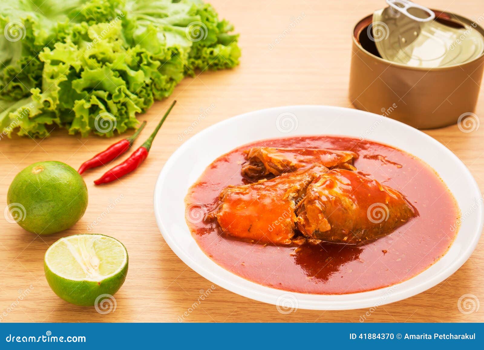 Canned Fish in Tomato Sauce on Plate Stock Photo - Image of container ...