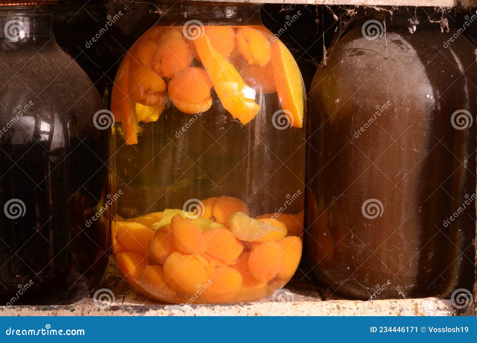 Canned Fruits and Compotes in Jars Covered with Dust and Cobwebs. Stock ...