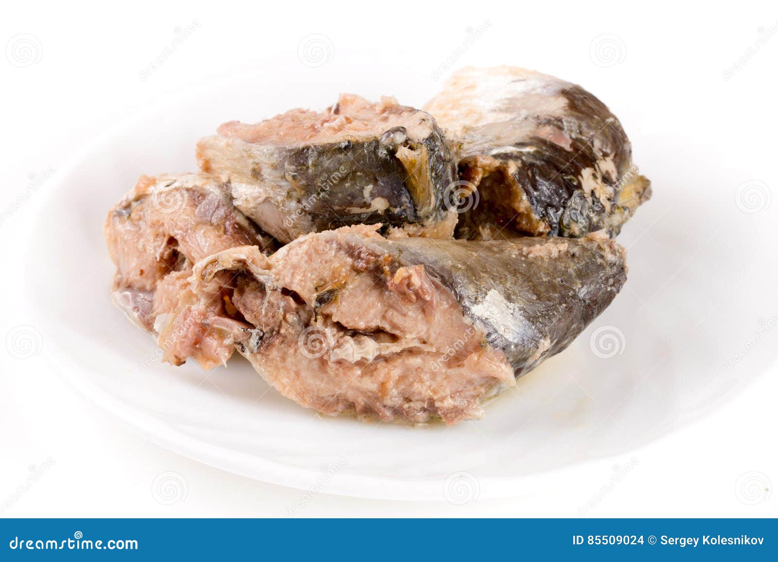 Canned Pilchard Fish on a Plate Isolated White Background Stock Photo ...