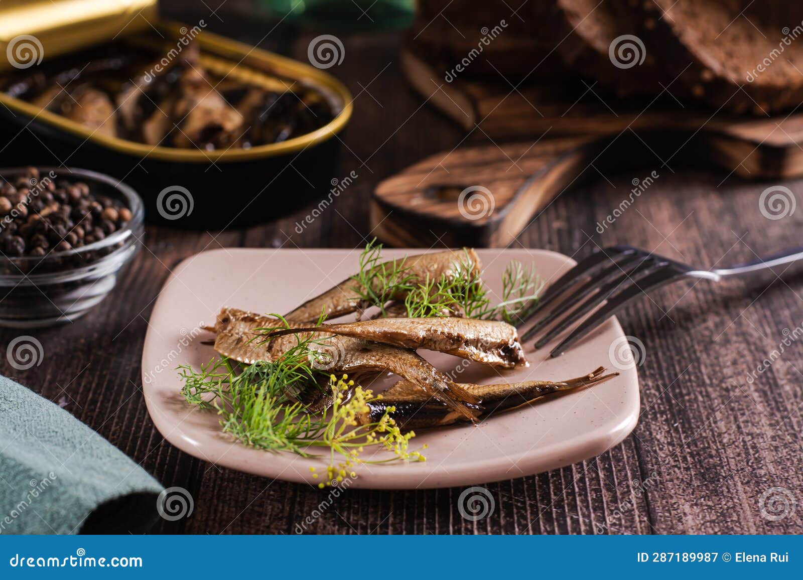 Canned Sprats Fish in Oil and Dill on a Plate on the Table Stock Image ...