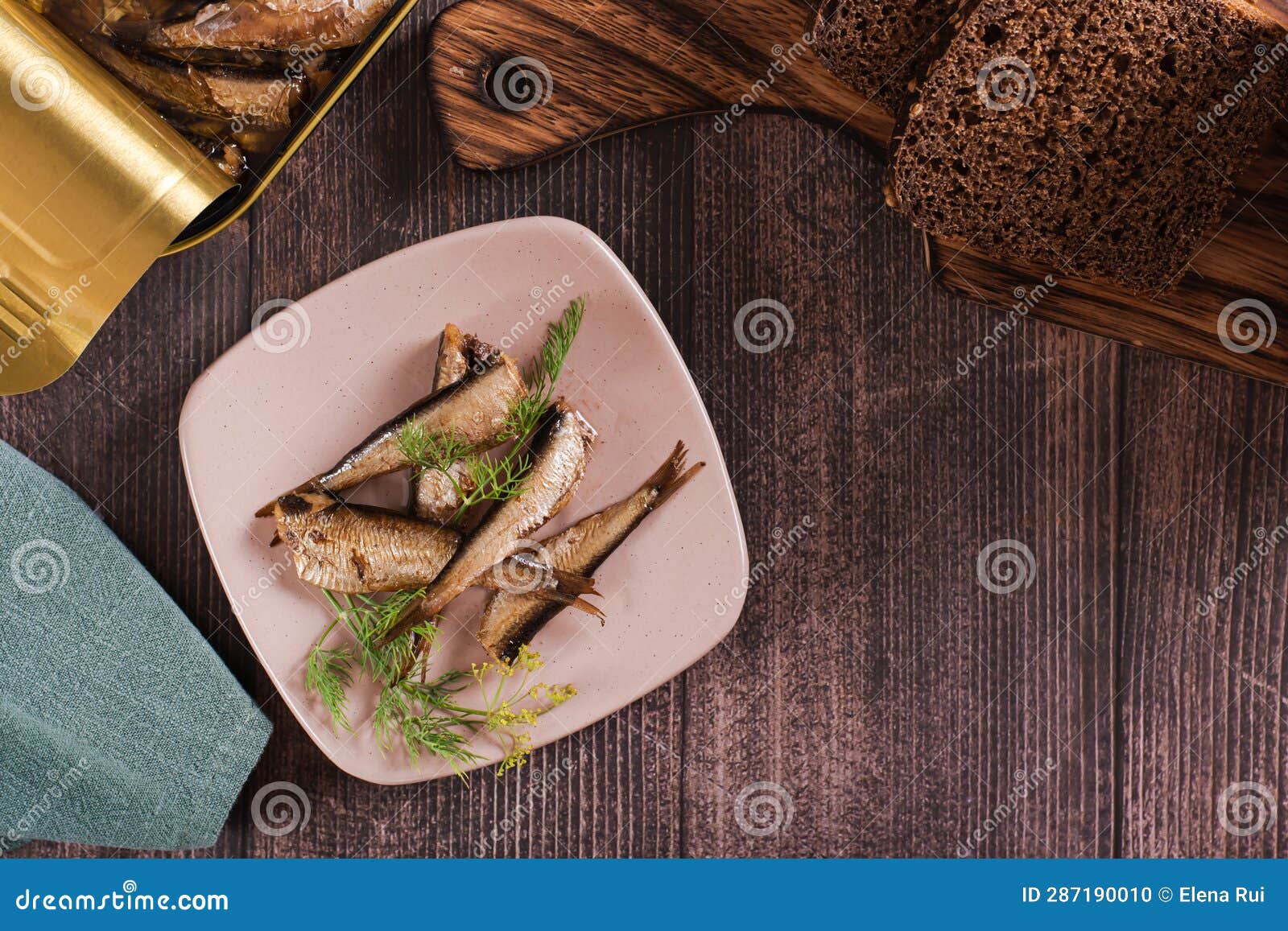 Canned Sprats Fish in Oil and Dill on a Plate on the Table Top View ...
