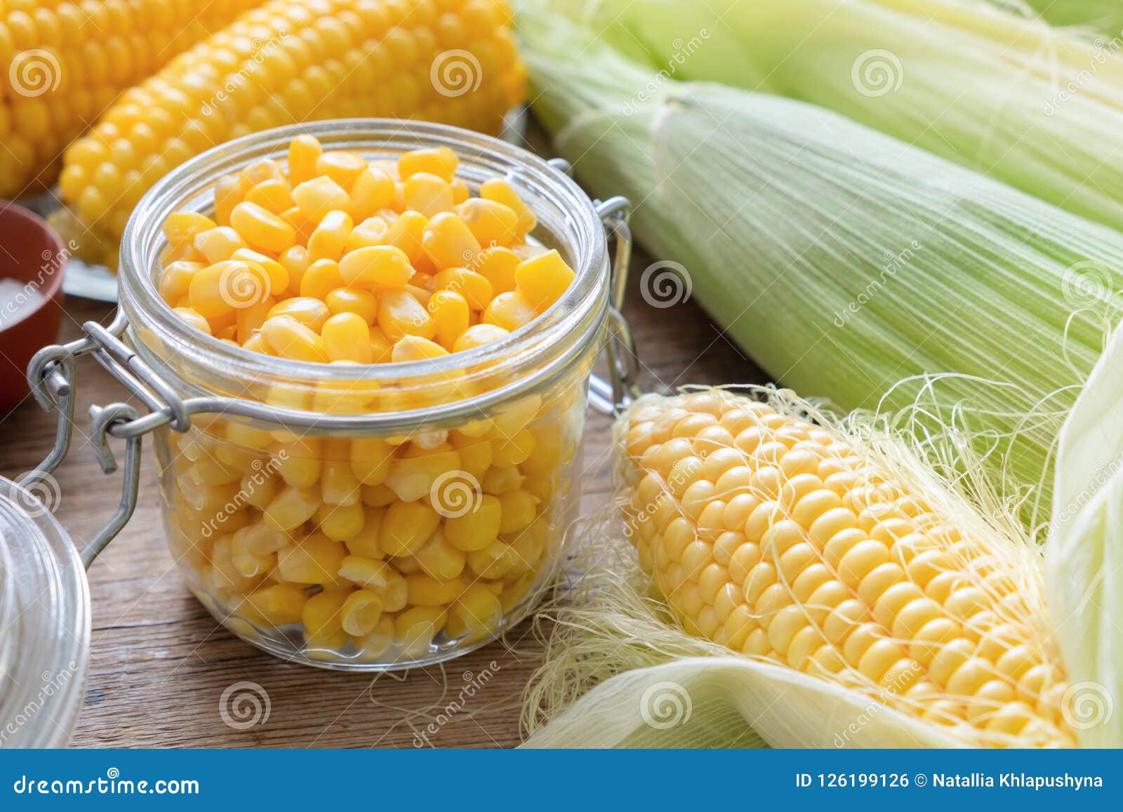Canned Sweet Corn in Glass Jar, Fresh and Cooked Corn Cobs. Stock Photo ...