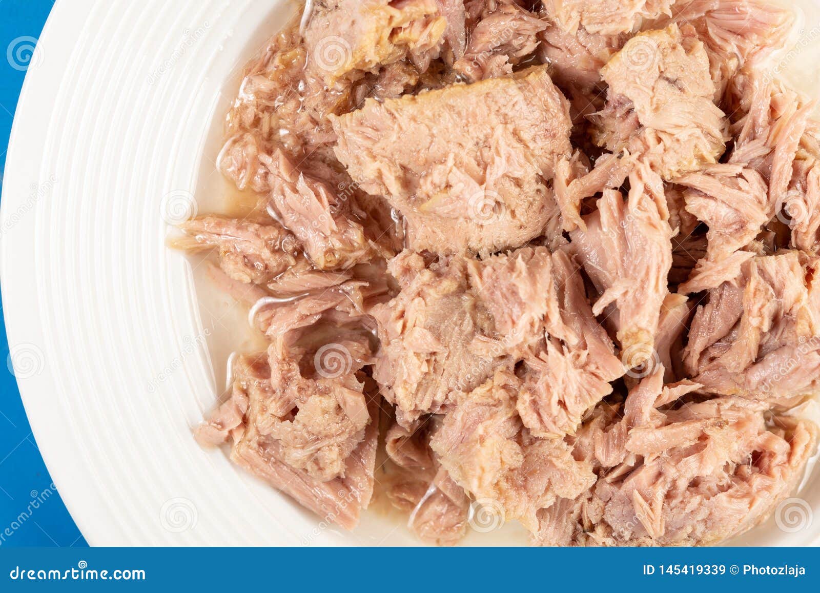 Canned Tuna Fish Slices Served on the White Plate Stock Image - Image ...
