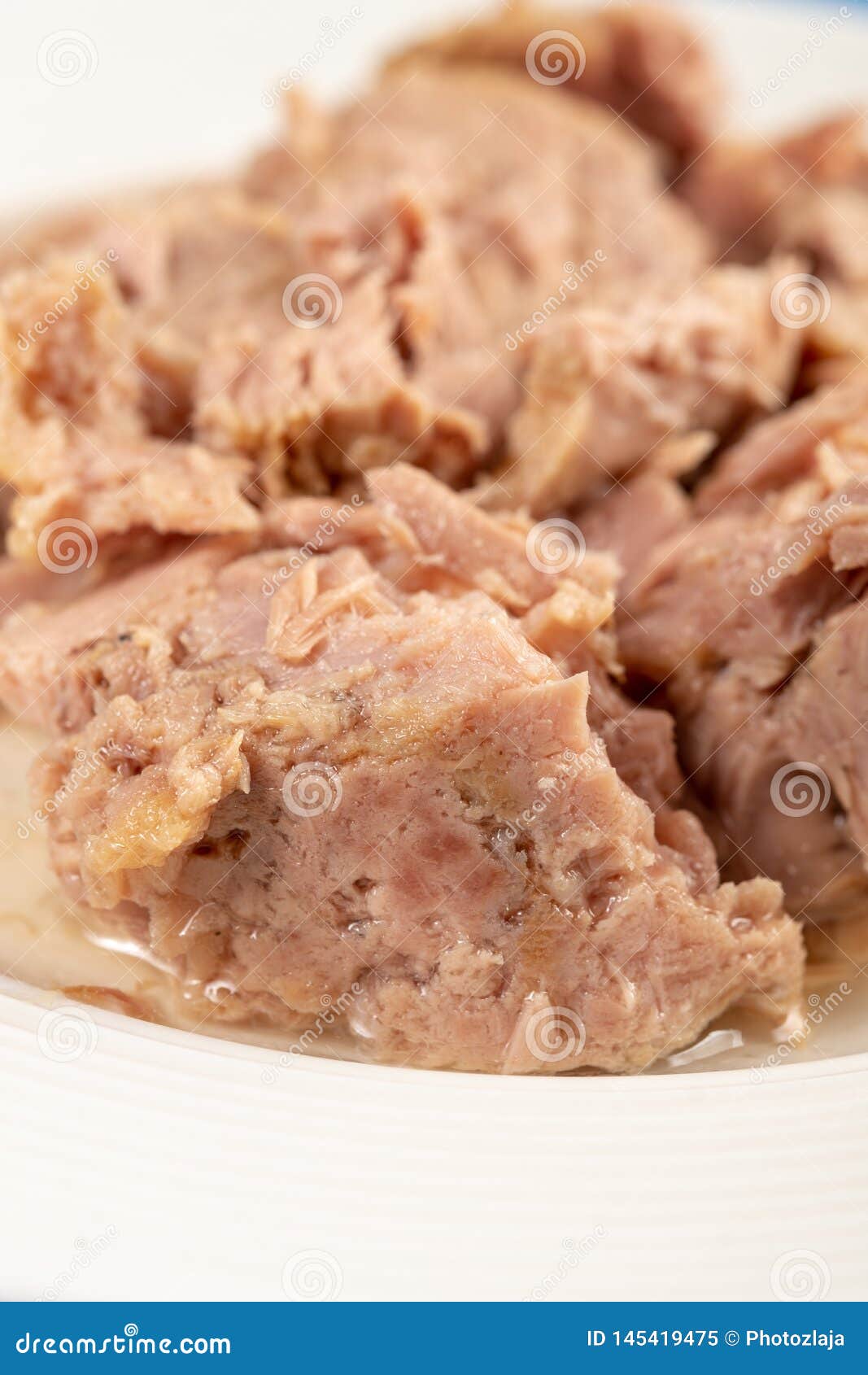 Canned Tuna Fish Slices Served on the White Plate Stock Image - Image ...
