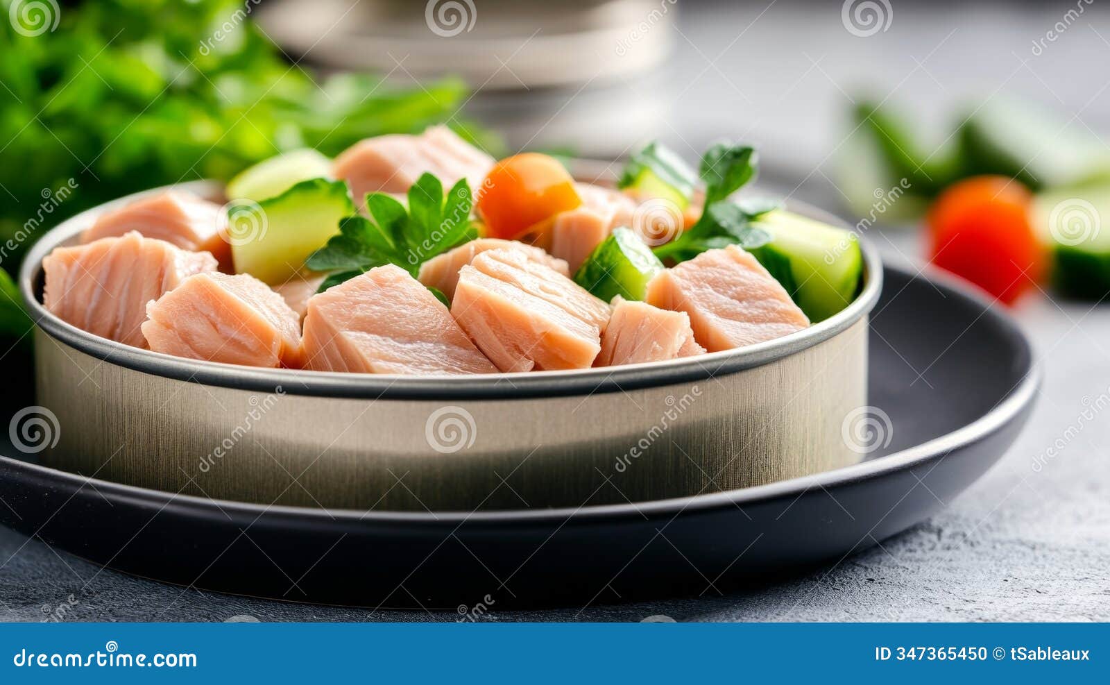Canned Tuna is Presented on a Plate with Chunks of Fish, Fresh Greens ...