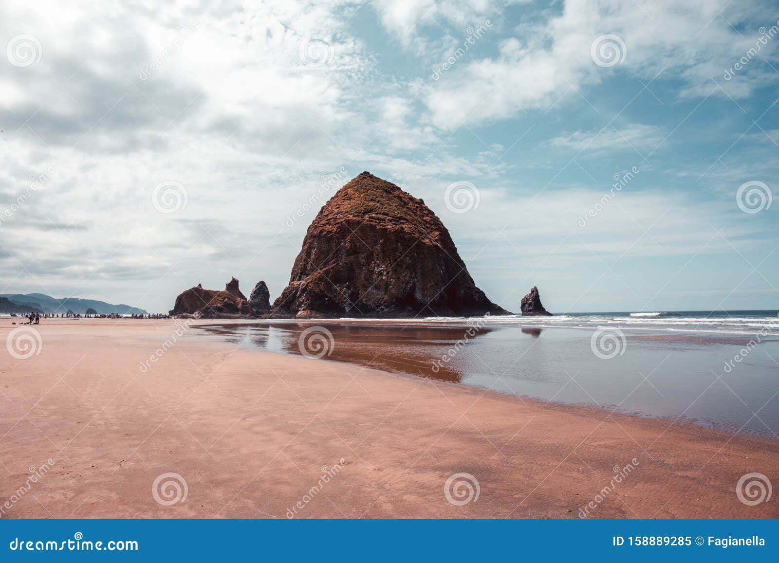 Cannon Beach, Oregon Coast: The Famous Haystack Rock Reflects Itself In ...
