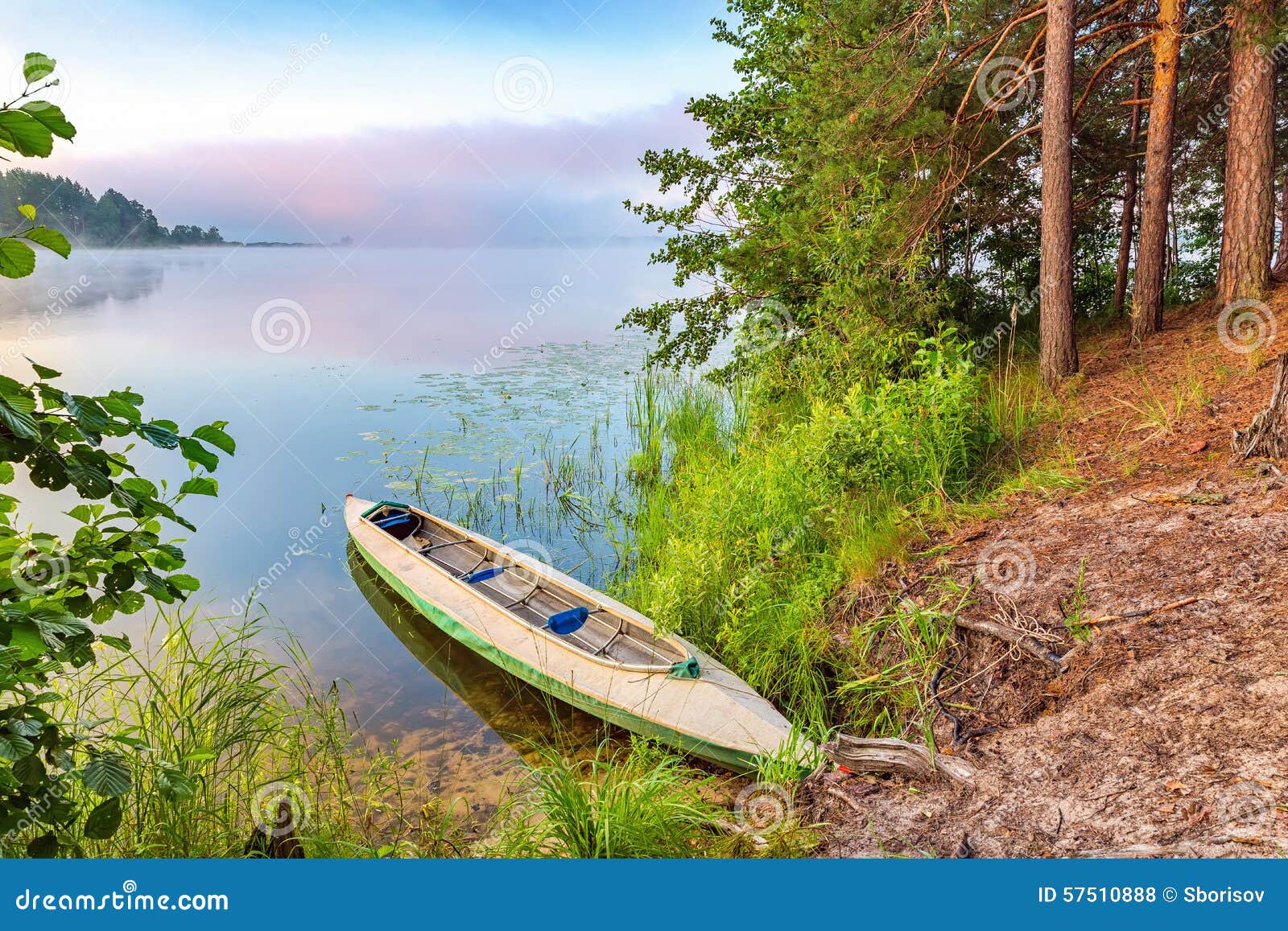 Canoe on a lake stock photo. Image of tourism, green - 57510888