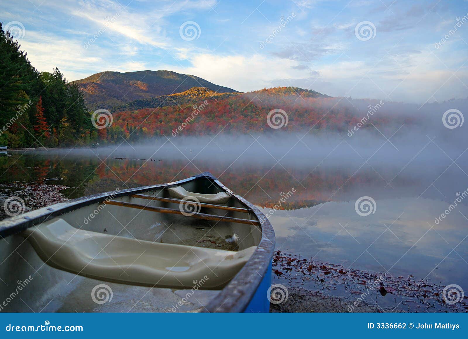 Canoe on Lakeside Beach stock photo. Image of calm, morning - 3336662