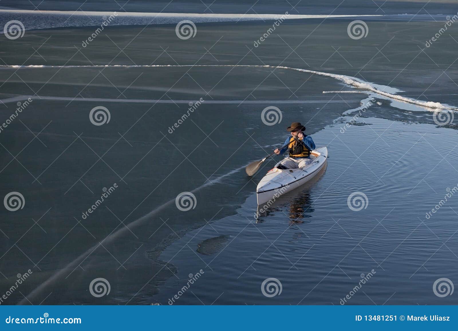 Canoe Paddling on Ice Covered Lake Stock Image - Image of winter ...