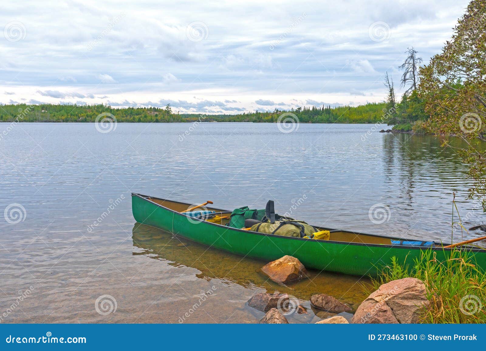 Canoe Ready on a Calm Lake stock photo. Image of horizontal - 273463100