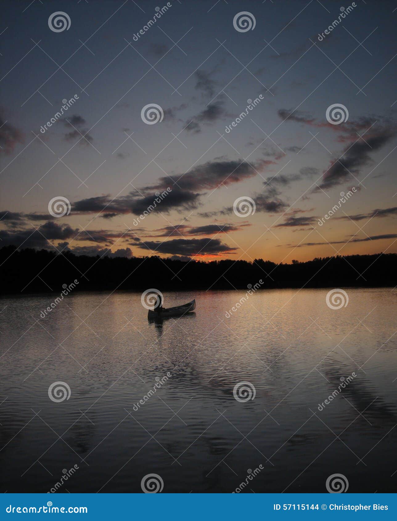Canoe at Sunset stock photo. Image of canoe, clouds, lake - 57115144