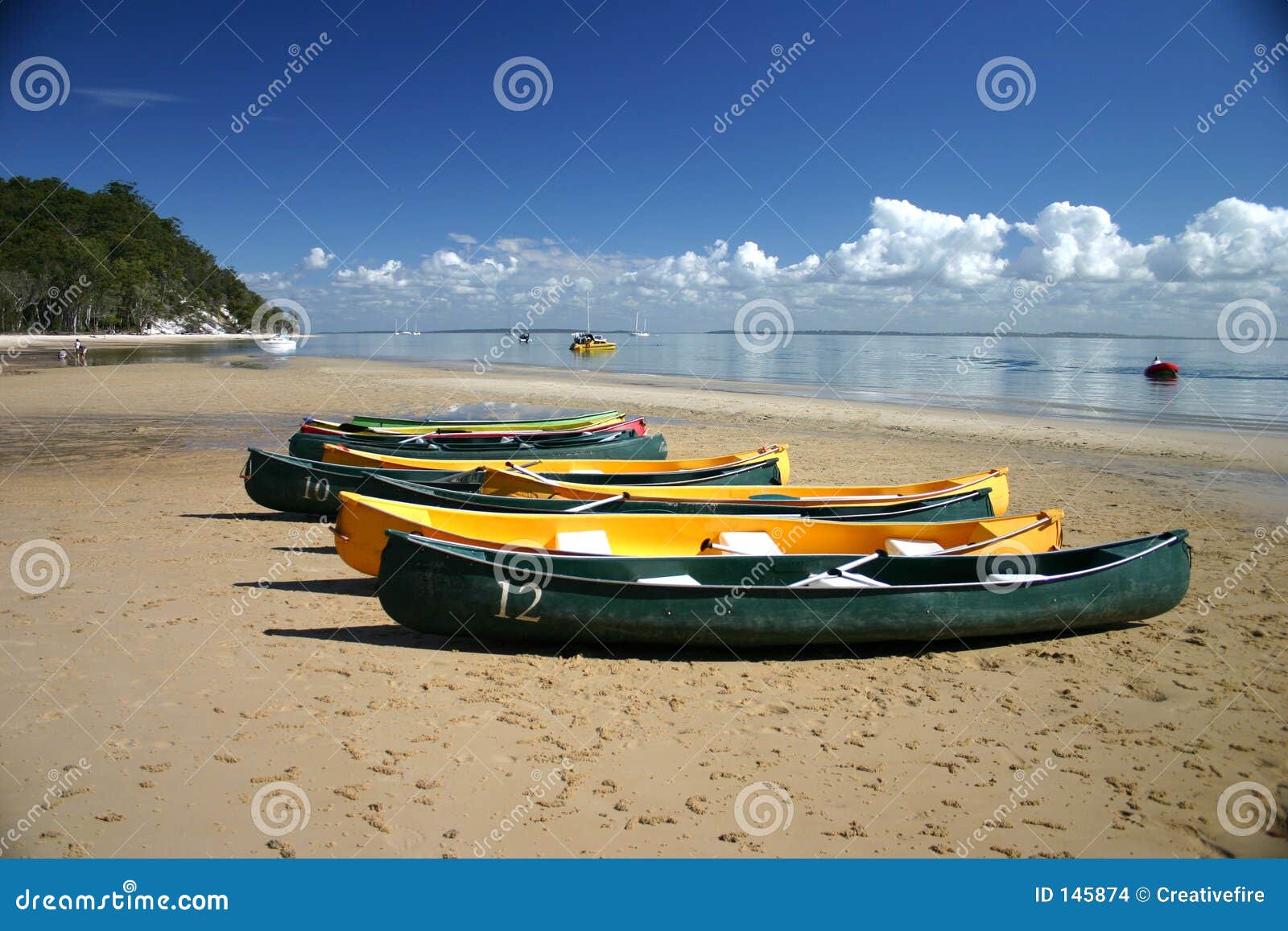 Canoes on Beach stock photo. Image of coastline, sand, canoes - 145874