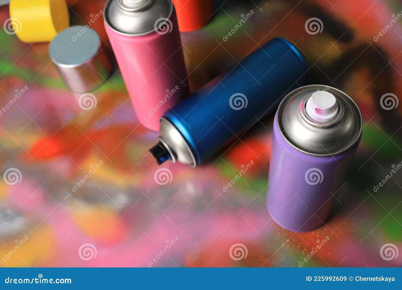 Cans of Different Graffiti Spray Paints on Color Background, Above View ...
