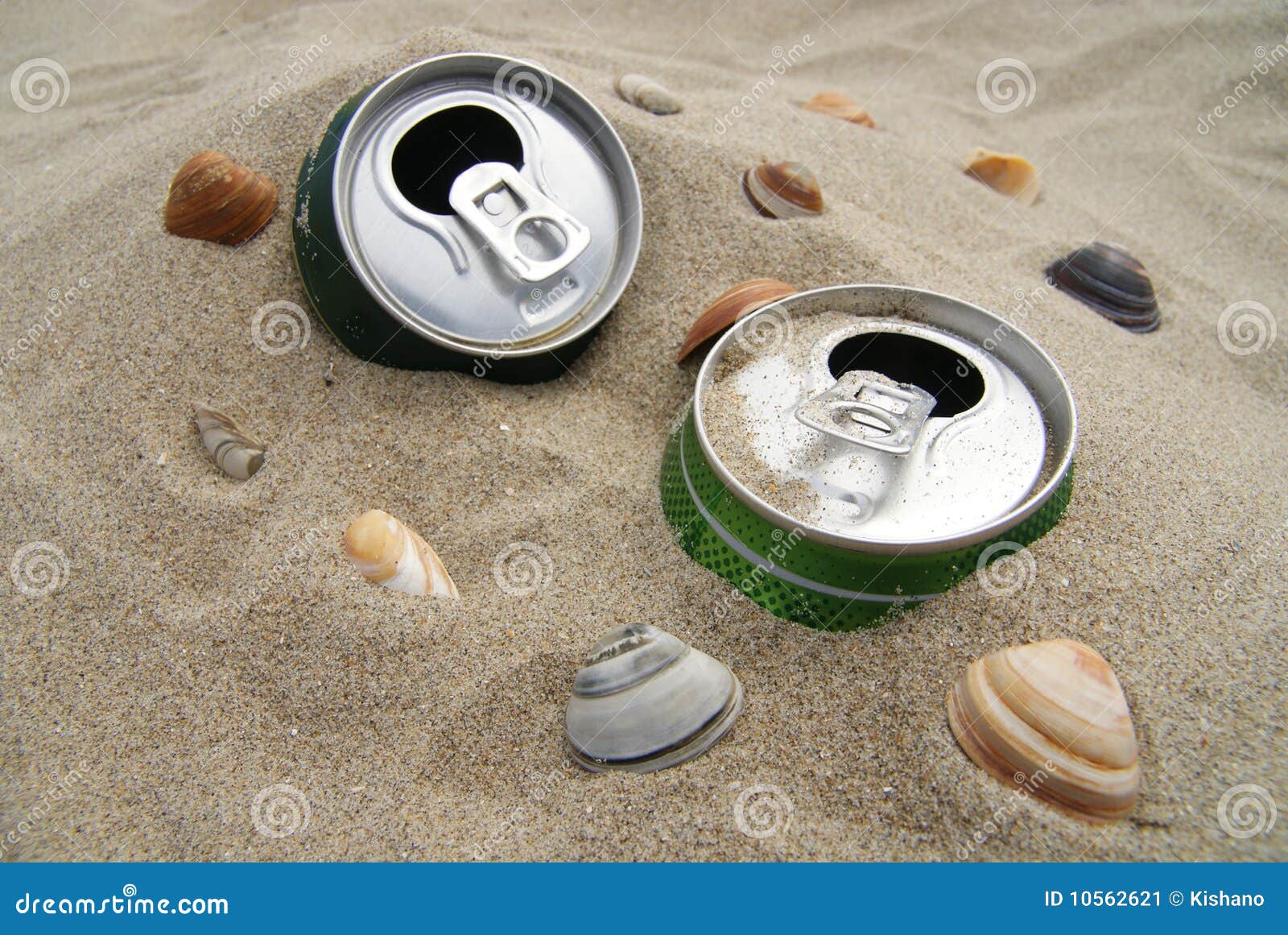 Cans in the sand stock image. Image of vacation, holidays - 10562621